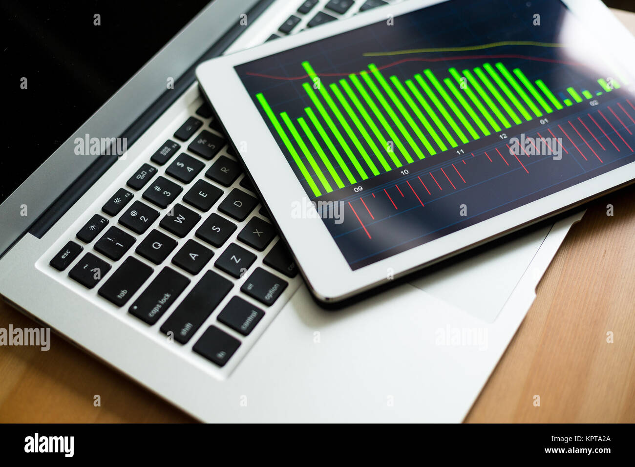 Tablet computer showing charts and diagram Stock Photo - Alamy