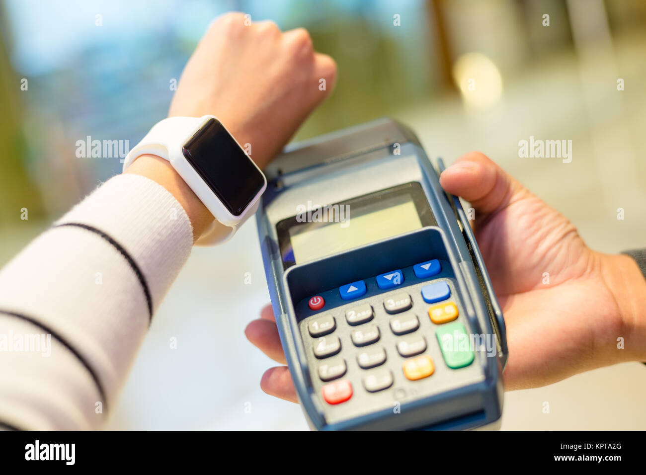 Woman using wearable smartwatch for paying on pos machine Stock Photo ...