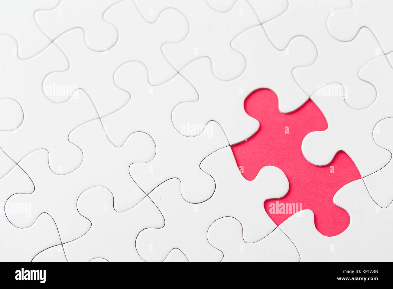 Puzzle with missing piece in red color Stock Photo - Alamy