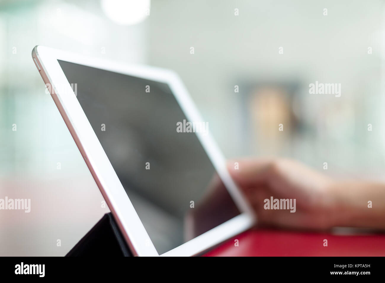 Human hand use of tablet pc Stock Photo - Alamy