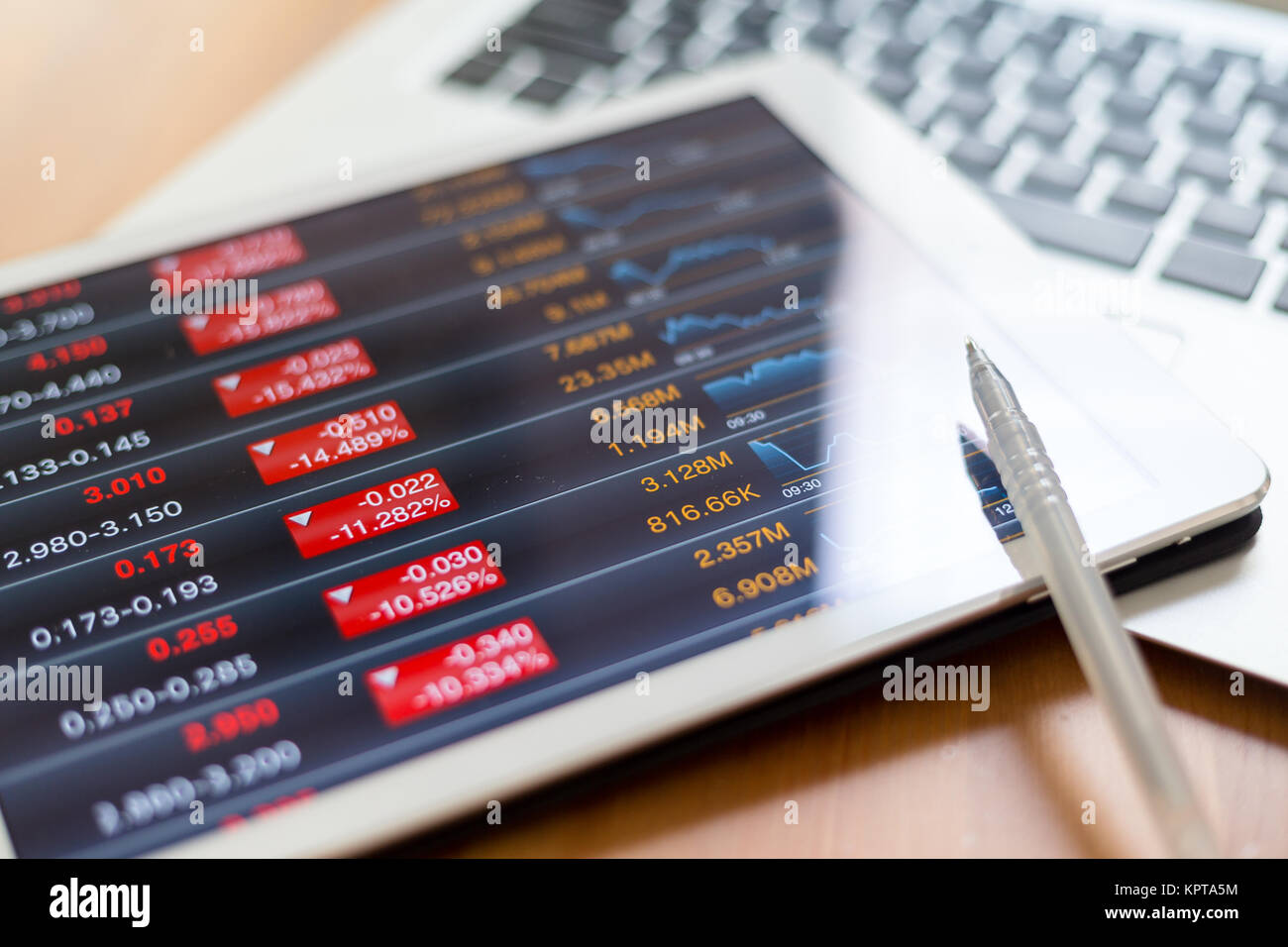 Digital tablet with stock market graph Stock Photo - Alamy