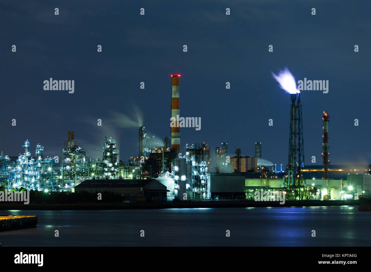 Refinery petrochemical factory at night Stock Photo - Alamy