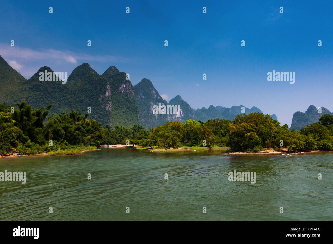 View of the Li River with the tall limestone peaks on the background ...
