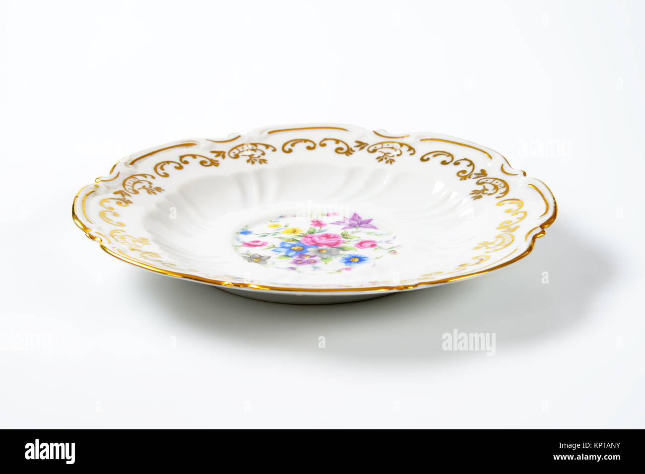 antique plate with floral pattern and decorative rim Stock Photo - Alamy