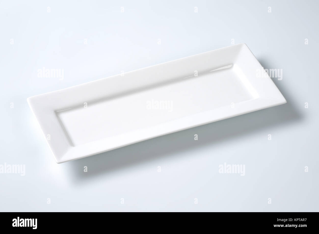 white rectangular plate with rim Stock Photo - Alamy