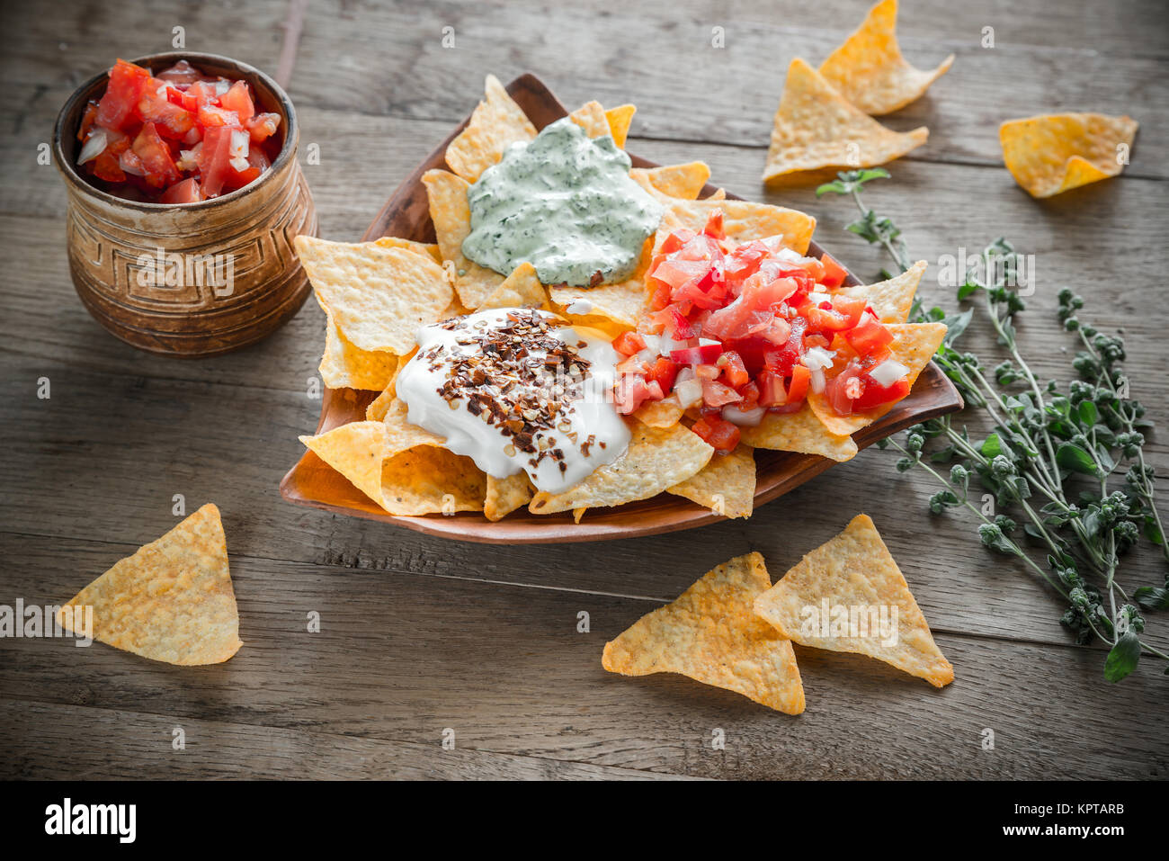 Cheese nachos with different types of sauce Stock Photo - Alamy