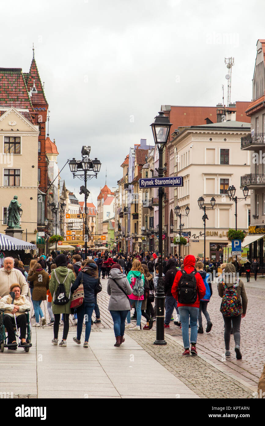 Tourists and shoppers in the medieval polish city of Torun Poland ...