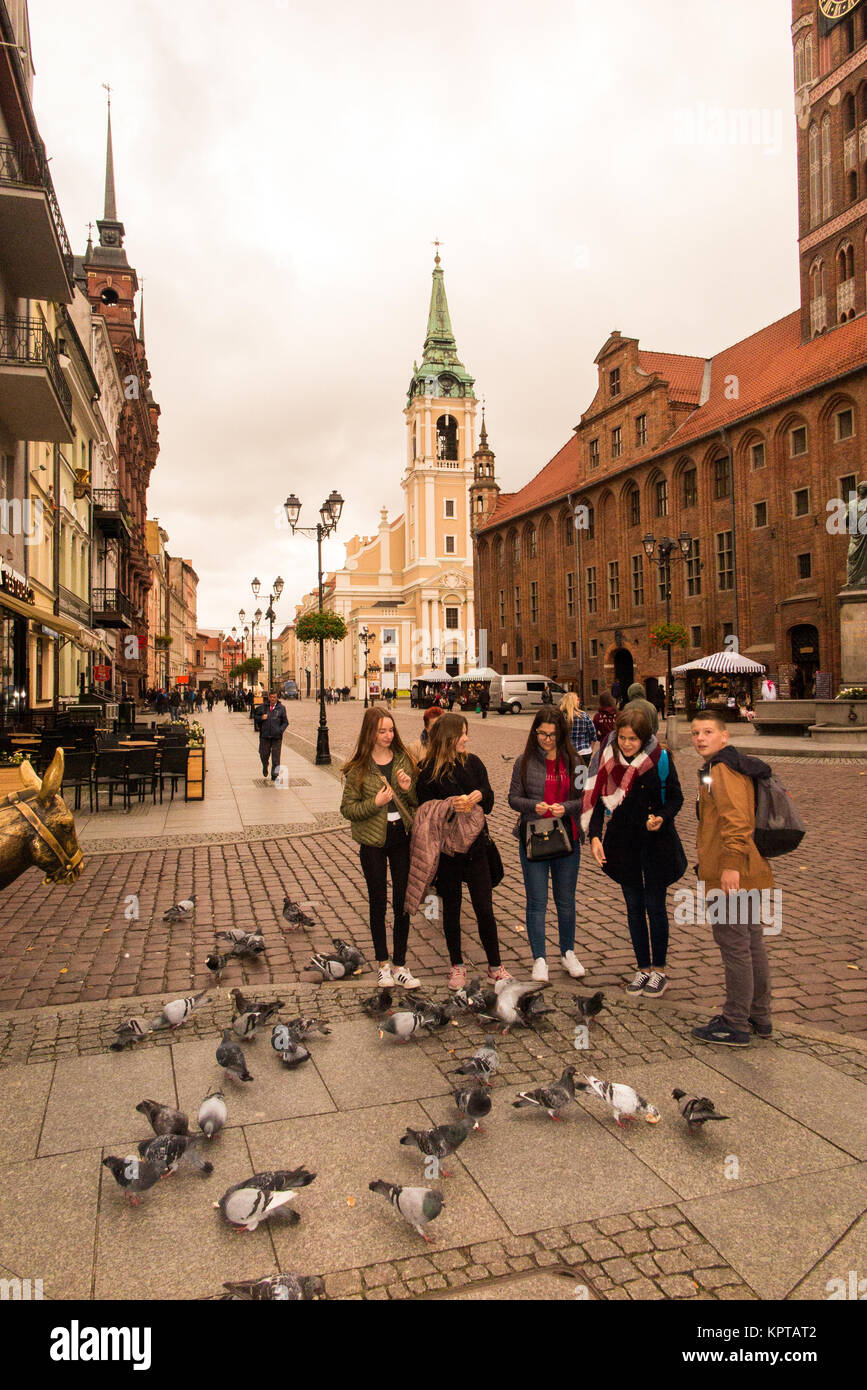 Tourists and shoppers in the medieval polish city of Torun Poland ...