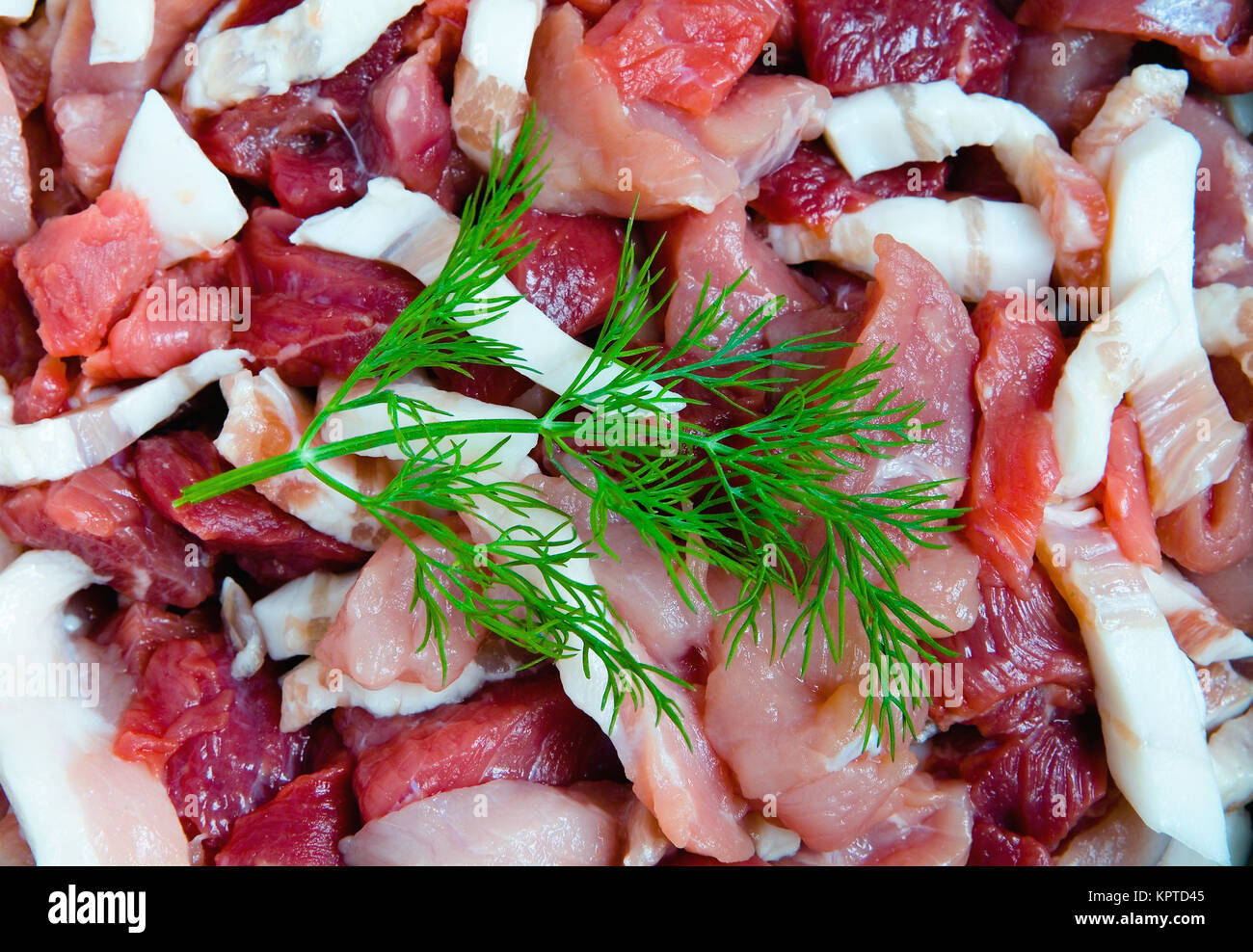 A branch of dill lies on the cut meat. Cooking Stock Photo - Alamy