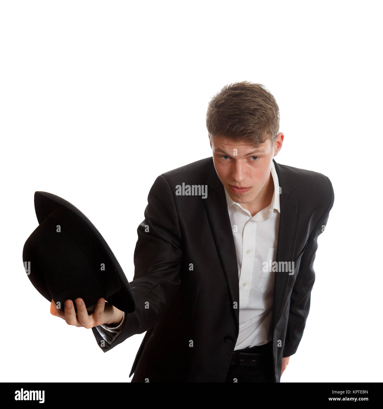 A young well dressed man greeting with his hat Stock Photo - Alamy