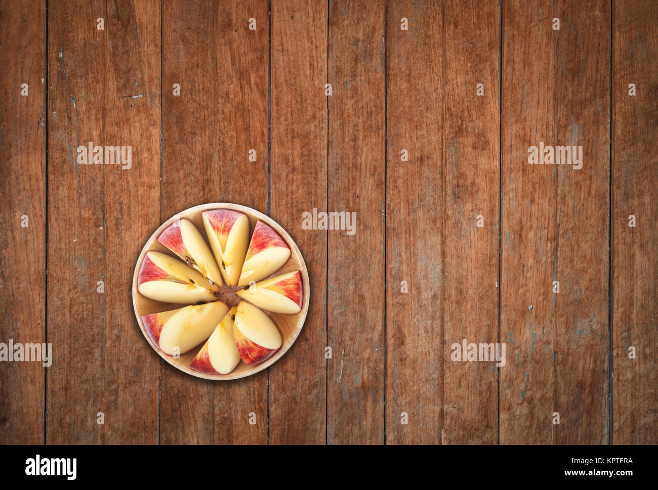 Top view of sliced apple on wooden background, stock photo Stock Photo ...