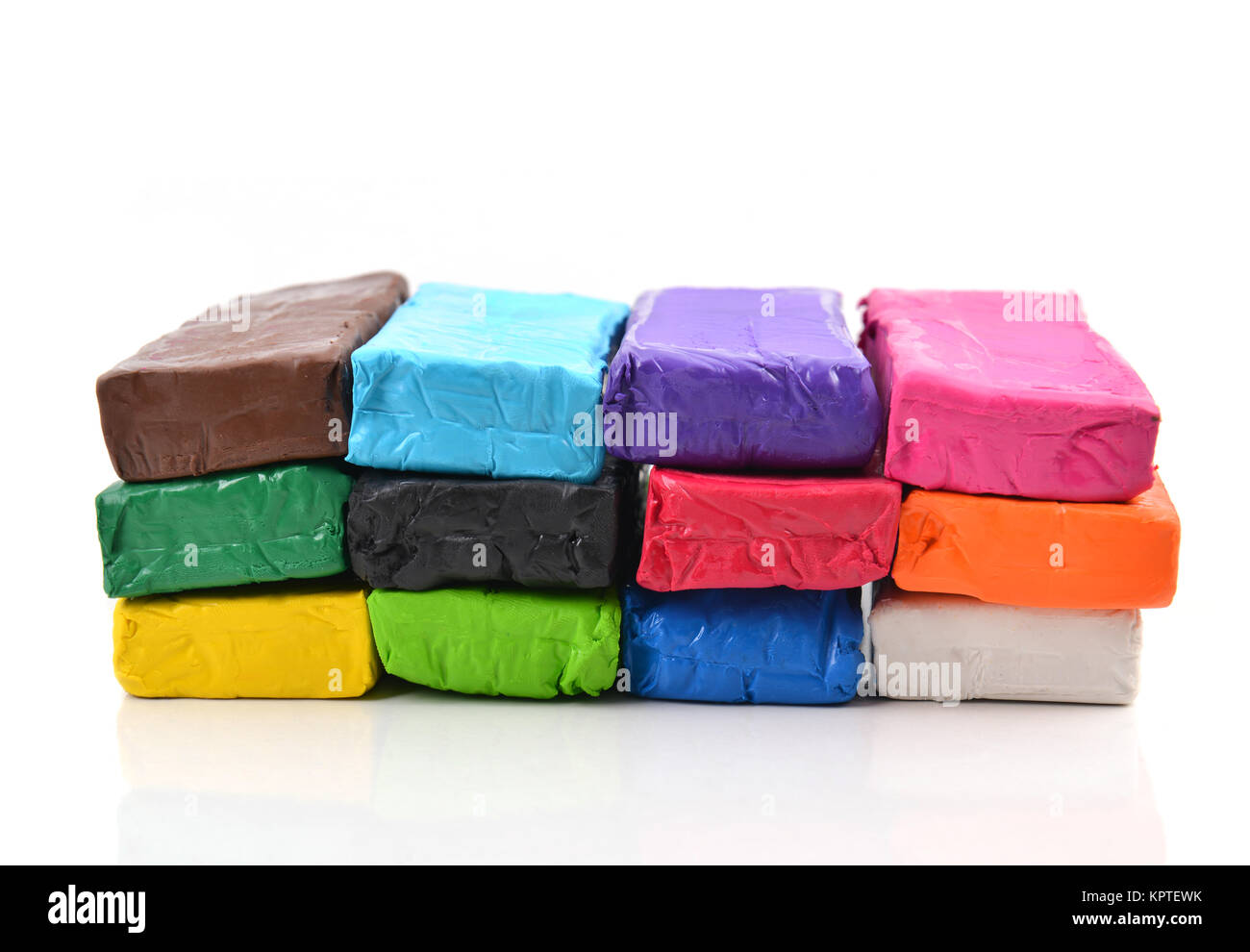 colorful modeling clay or plasticine for children on white background ...
