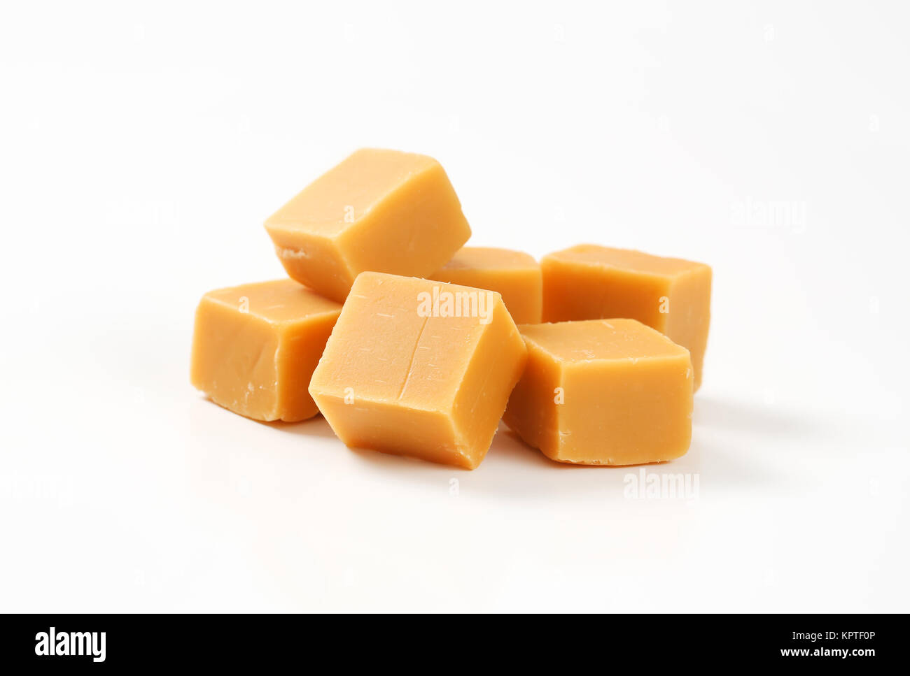 Chewy toffee candies on white background Stock Photo - Alamy