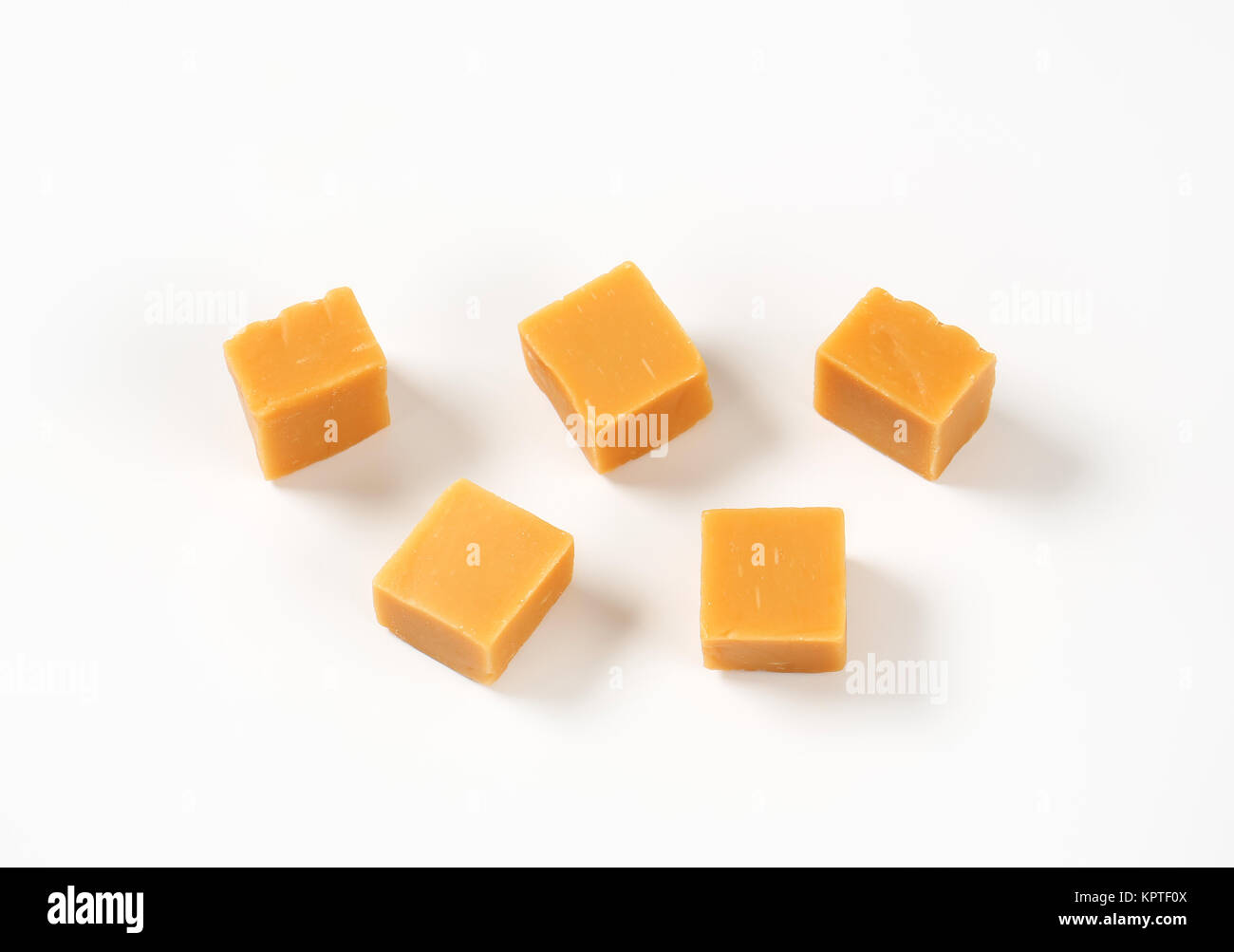 Chewy toffee candies on white background Stock Photo - Alamy
