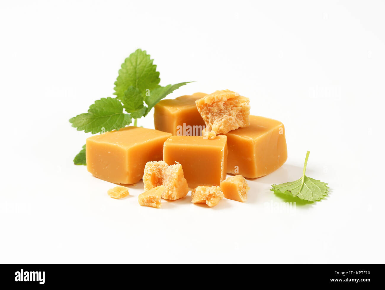 Chewy toffee candies on white background Stock Photo - Alamy