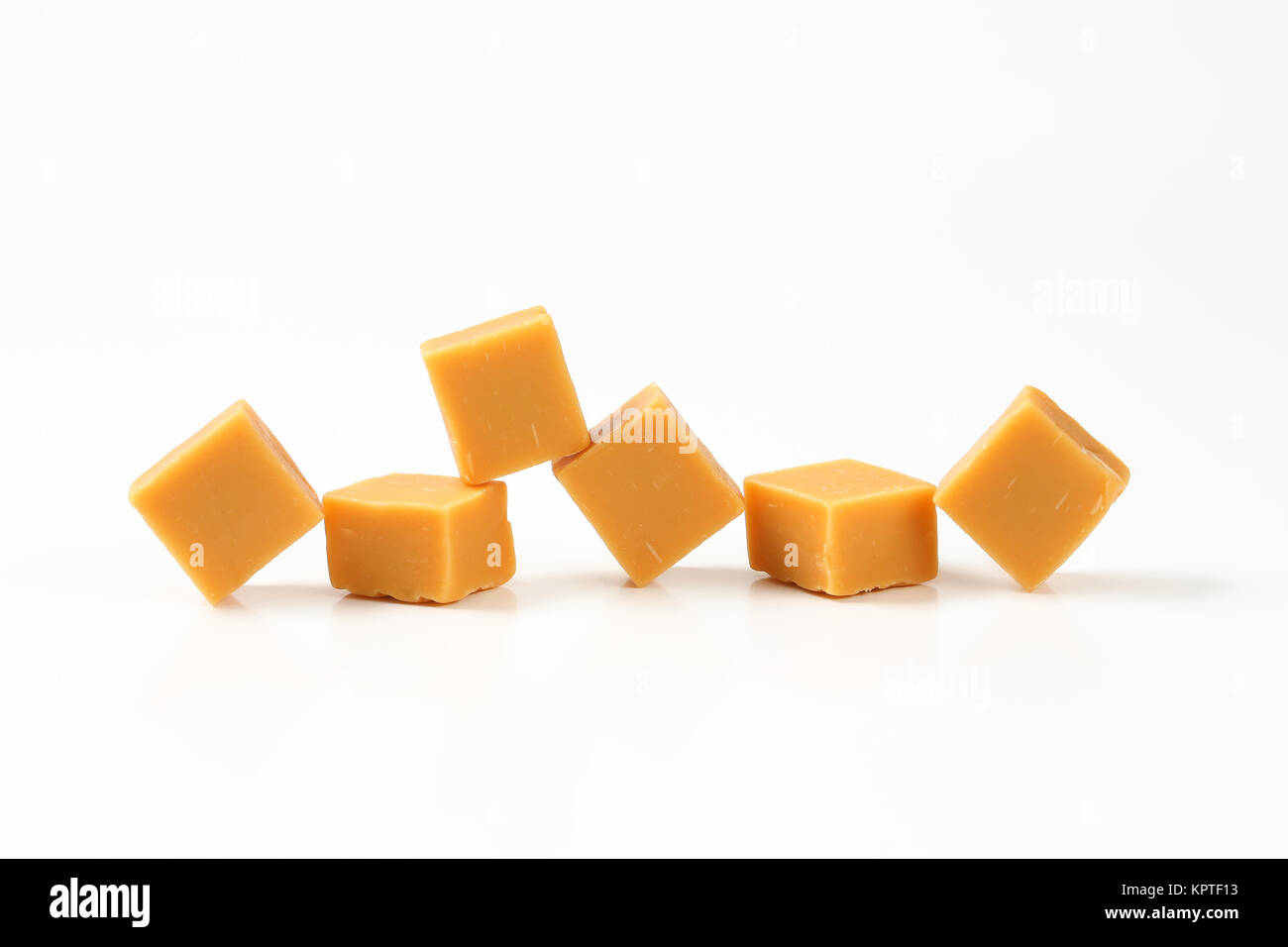 Chewy toffee candies on white background Stock Photo - Alamy