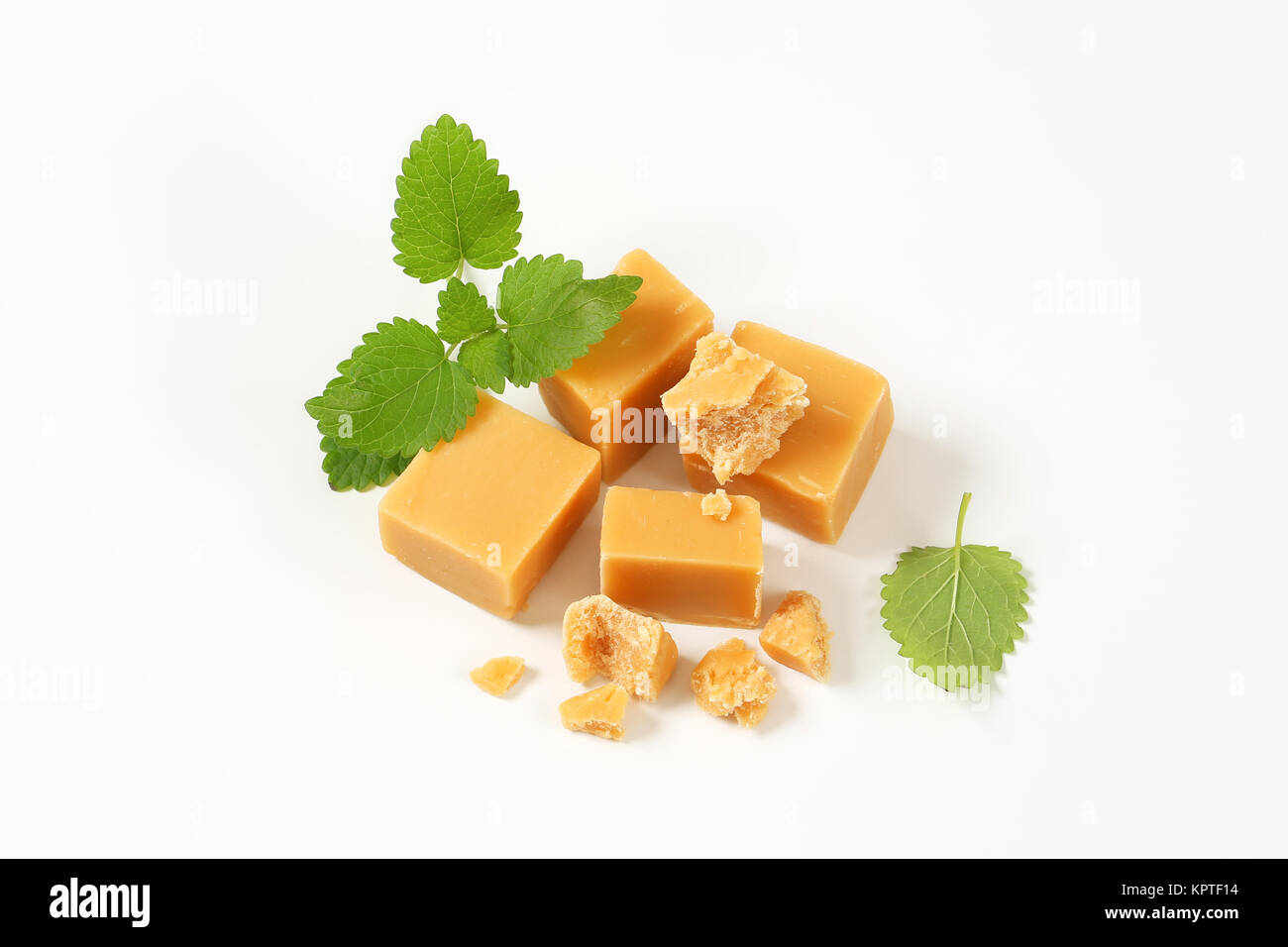 Chewy toffee candies on white background Stock Photo - Alamy