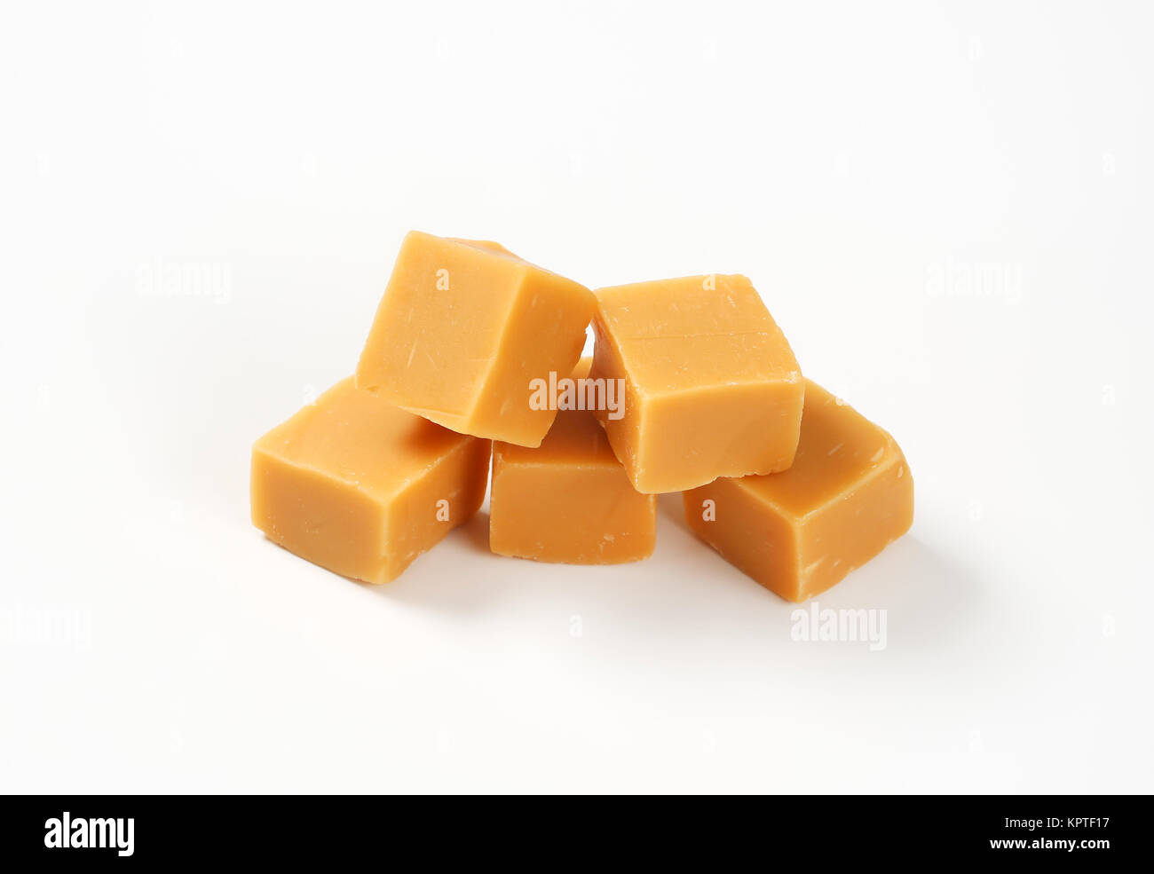 Chewy toffee candies on white background Stock Photo - Alamy