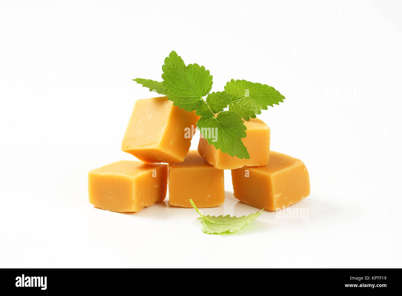 Chewy toffee candies on white background Stock Photo - Alamy
