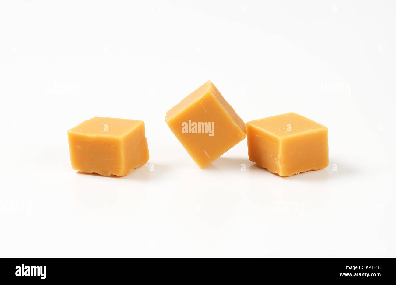 Chewy toffee candies on white background Stock Photo - Alamy