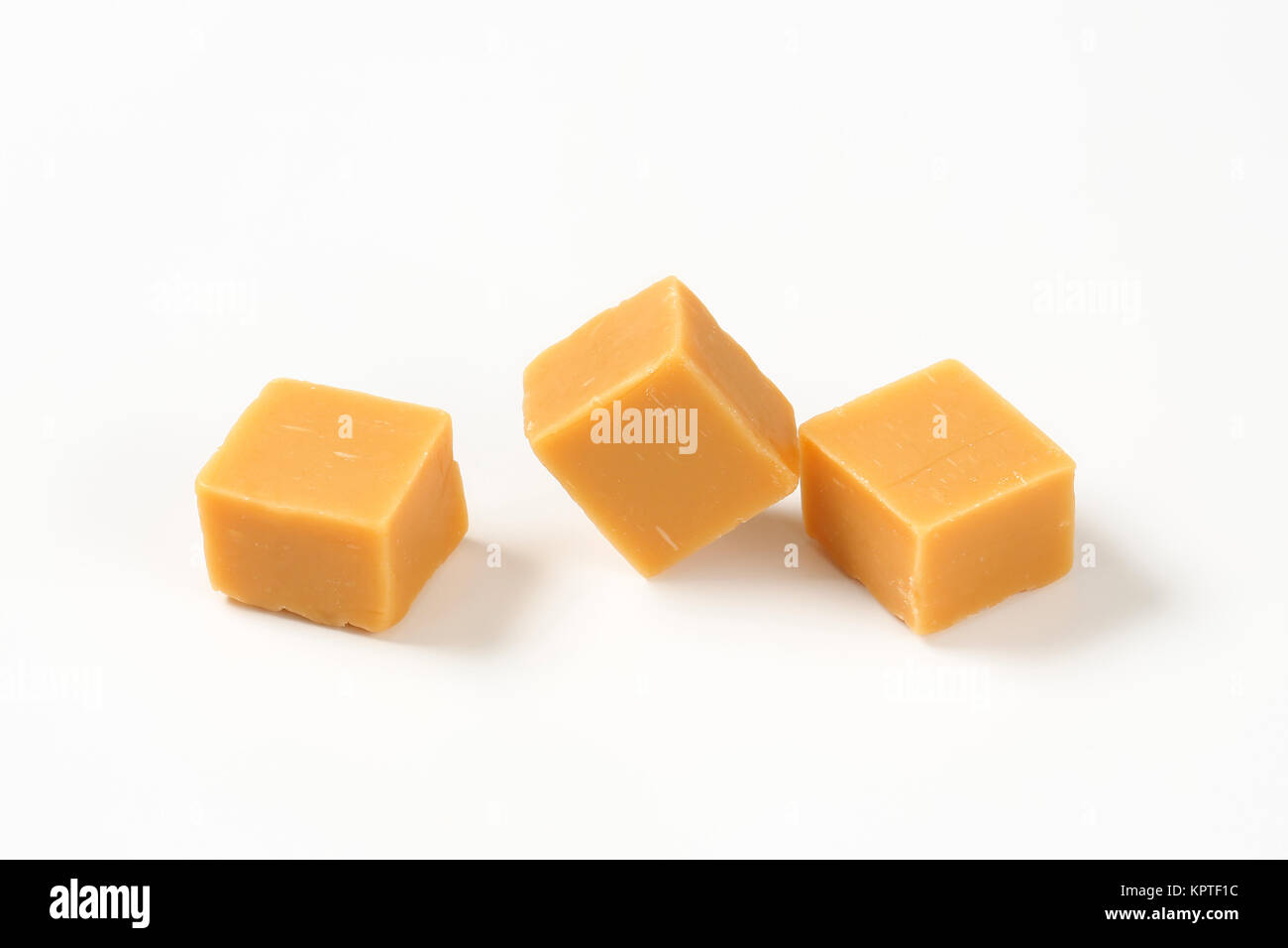 Chewy toffee candies on white background Stock Photo - Alamy