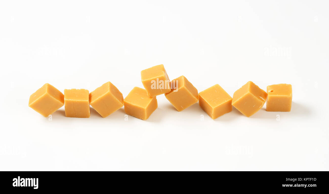 Chewy toffee candies on white background Stock Photo - Alamy
