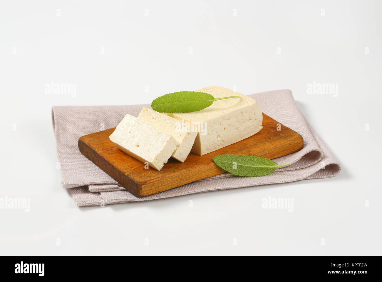 block of fresh tofu on cutting board Stock Photo - Alamy