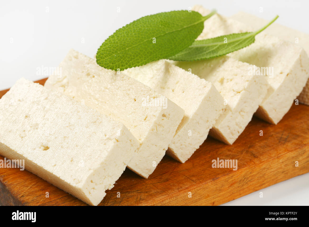 Slices of fresh tofu on cutting board Stock Photo - Alamy