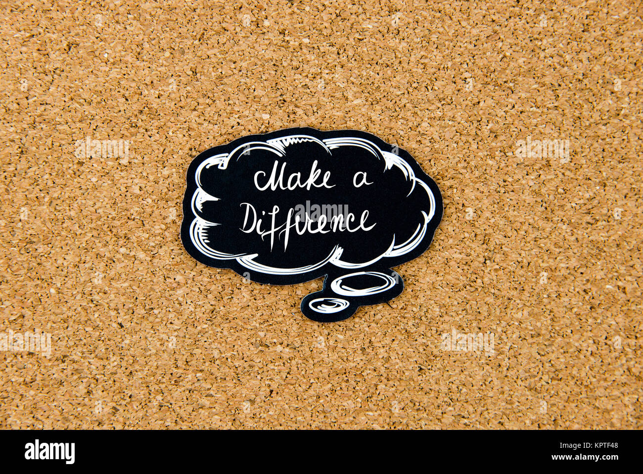 Make A Difference written on black thinking bubble over cork board ...