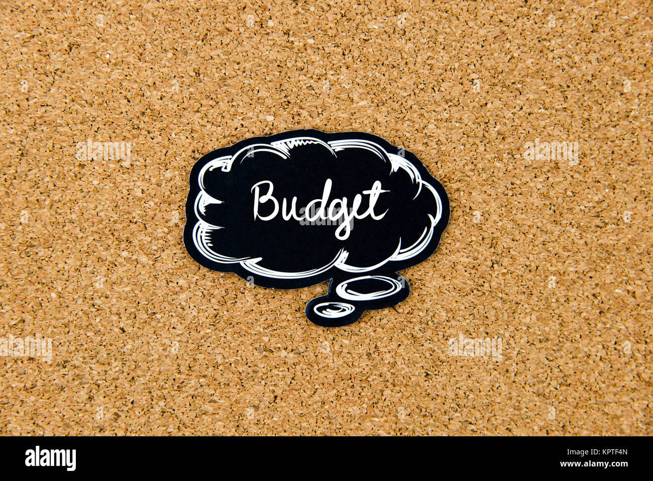 Budget written on black thinking bubble over cork board background ...