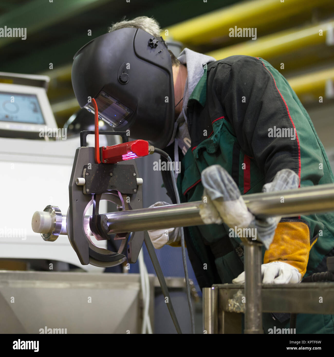 Industrial operator setting computer controlled process of orbital ...