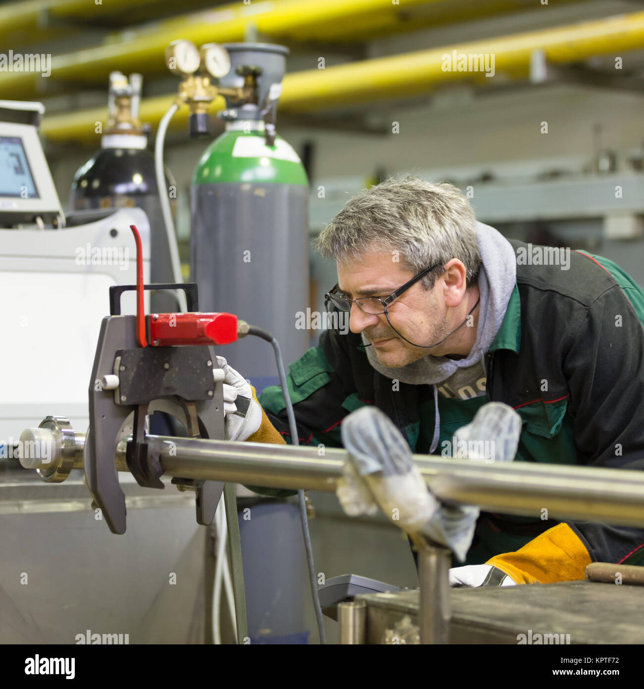 Industrial operator setting computer controlled process of orbital ...