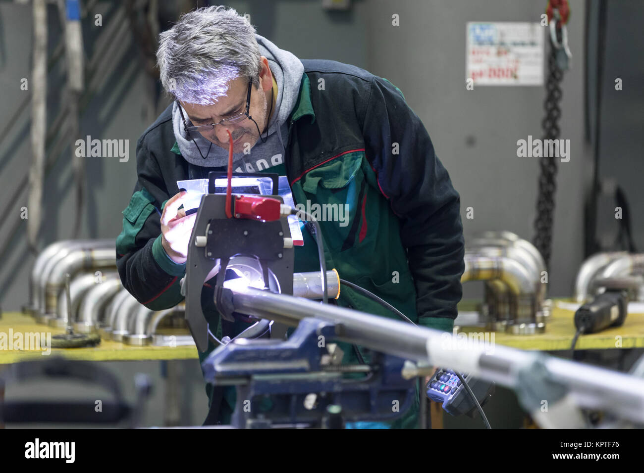 Industrial operator setting computer controlled process of orbital ...
