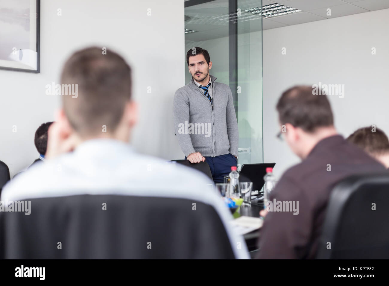 Team manager and business owner leading in-house business meeting ...