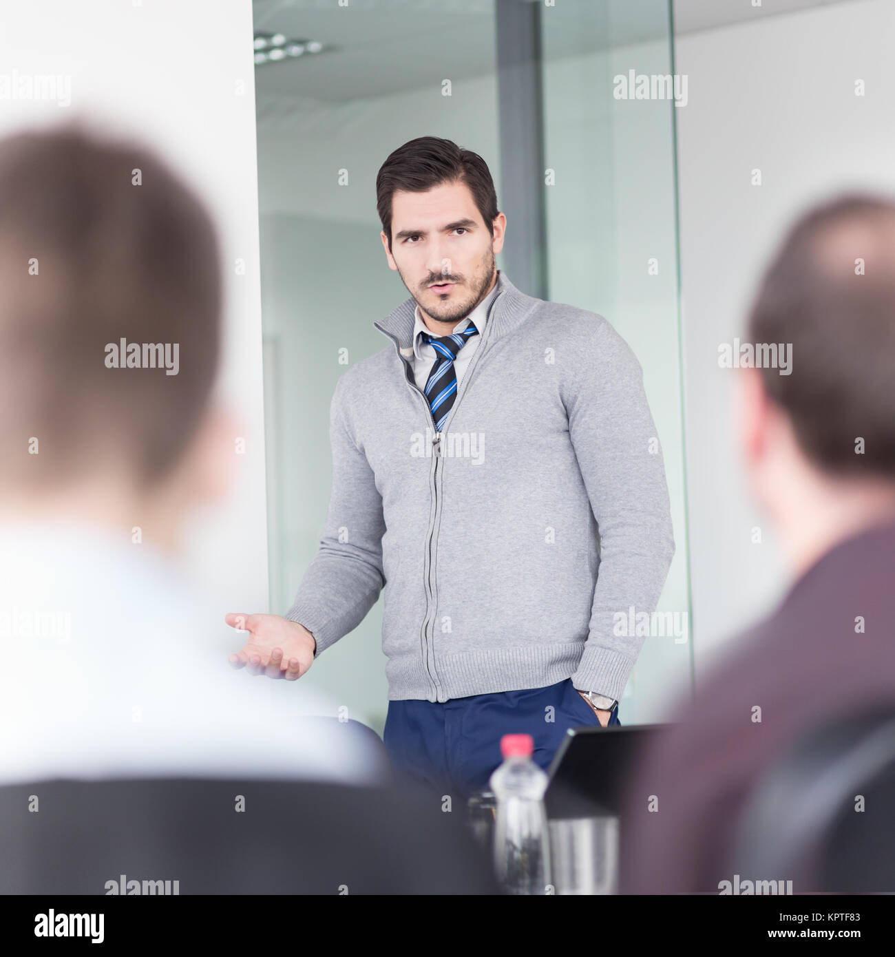 Team manager and business owner leading in-house business meeting ...