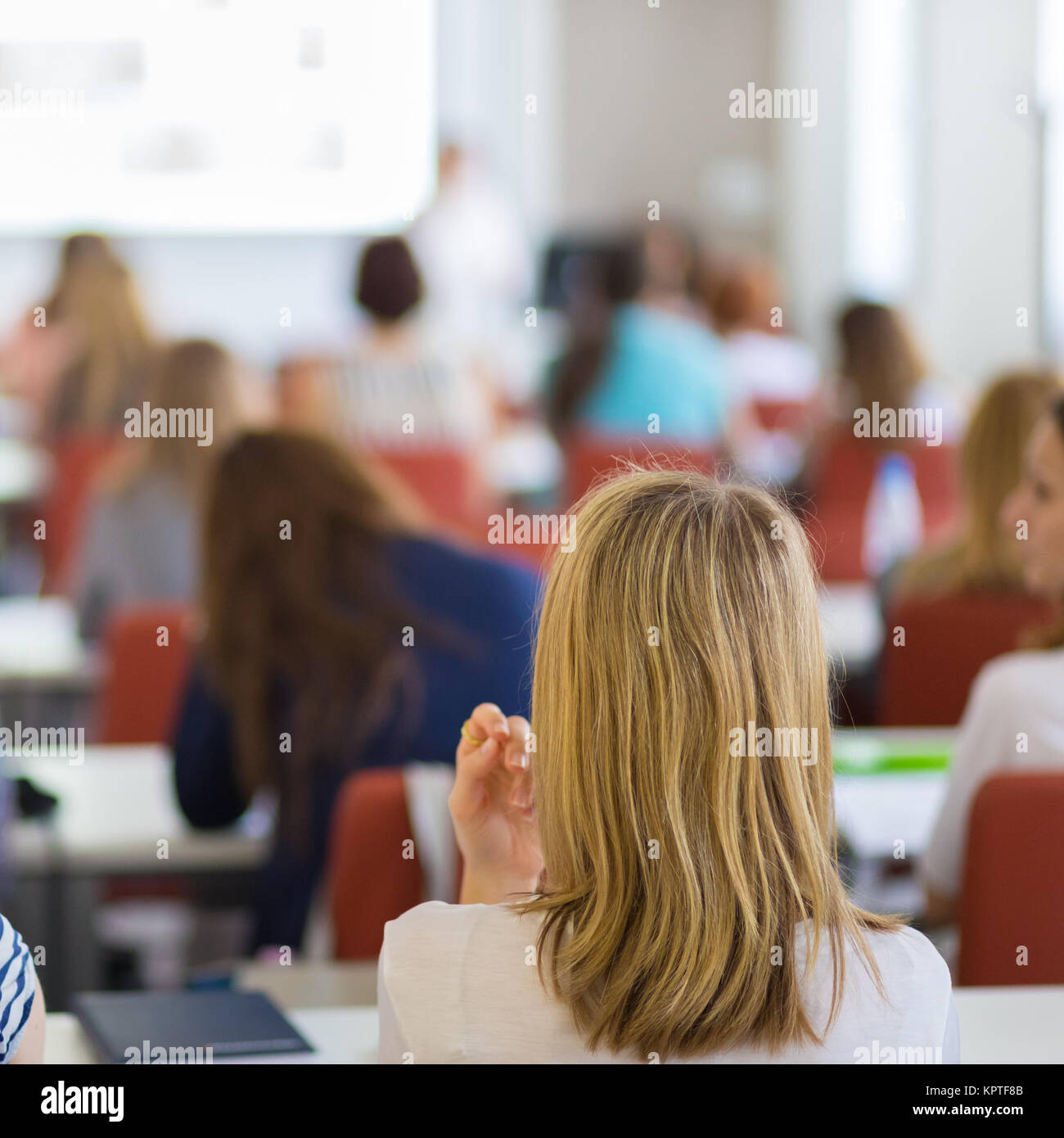 Speaker giving presentation in lecture hall at university. Participants ...