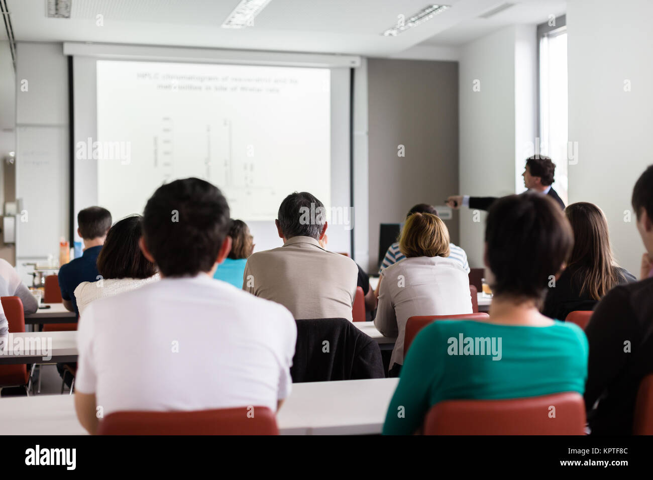 Speaker Giving a Talk at Business Meeting. Audience in the conference ...
