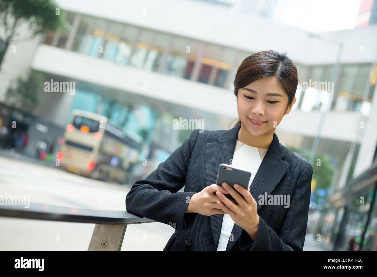 Young Business woman use of mobile phone Stock Photo - Alamy