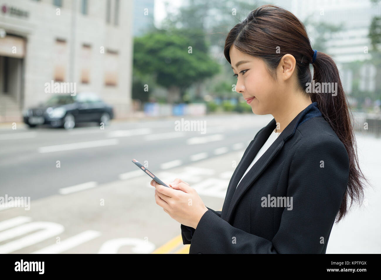 Business woman use of mobile phone Stock Photo - Alamy
