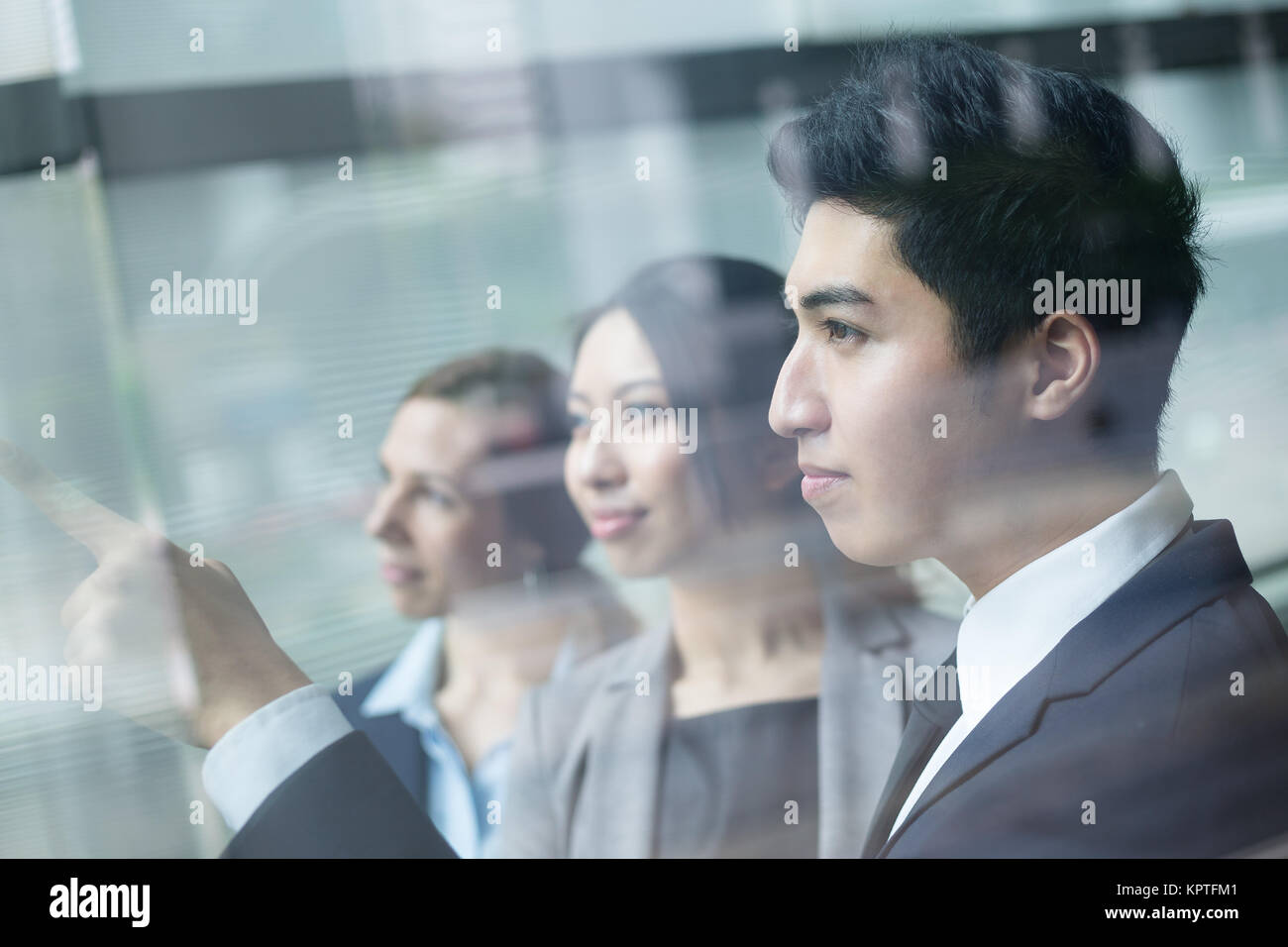 Business team finger pointing to target Stock Photo - Alamy