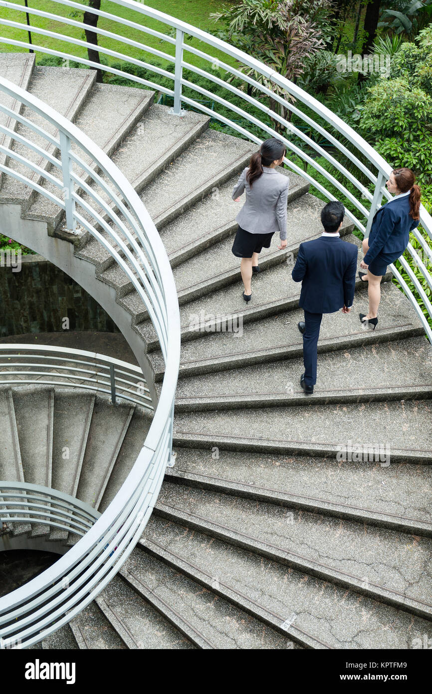 Business people walking up Stock Photo - Alamy