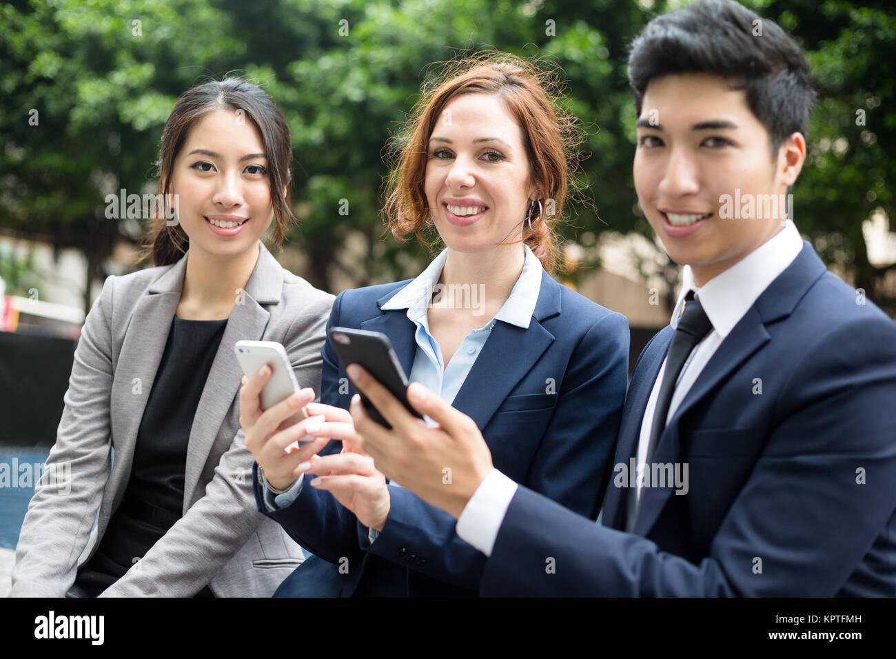Business people use of mobile phone Stock Photo - Alamy