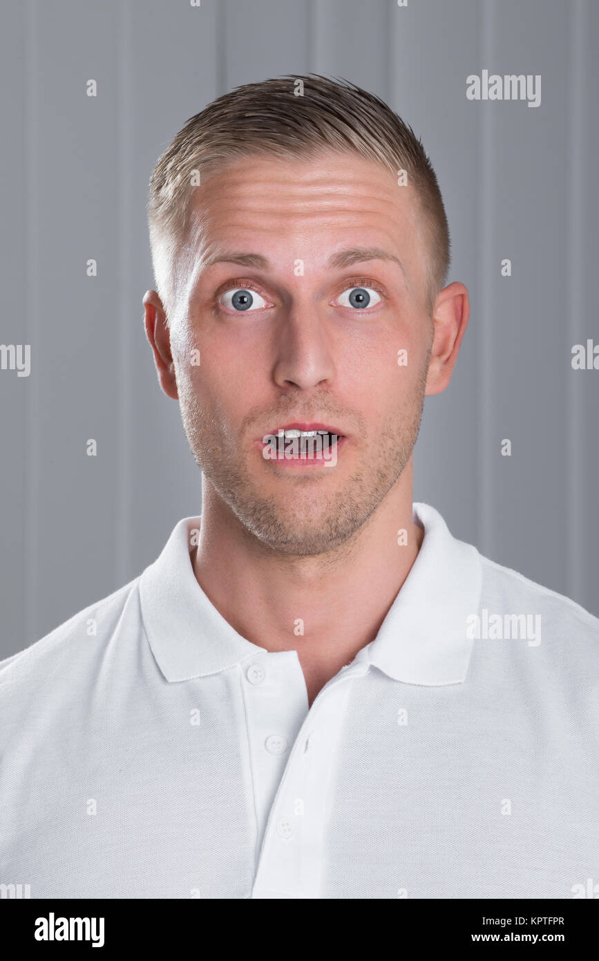 Portrait Of Surprised Man Stock Photo - Alamy