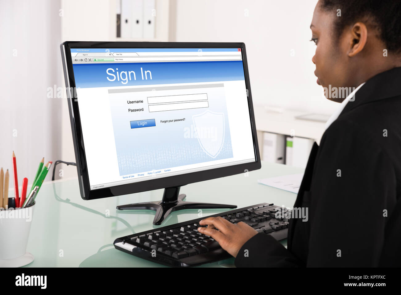 Businesswoman Signing Into Website On Computer Stock Photo - Alamy