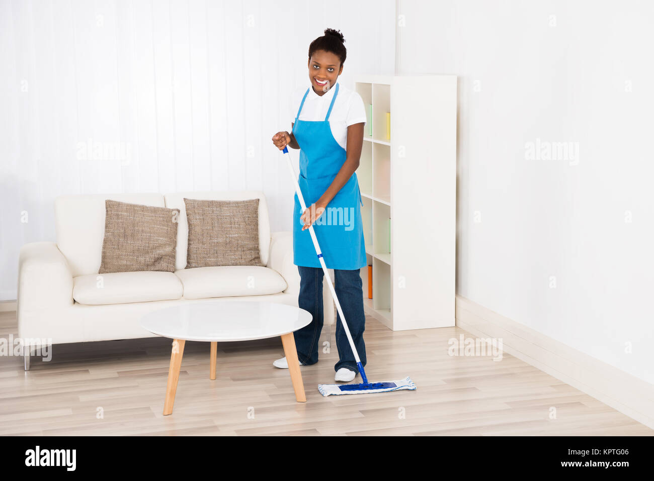 Female Janitor Mopping Floor Stock Photo - Alamy