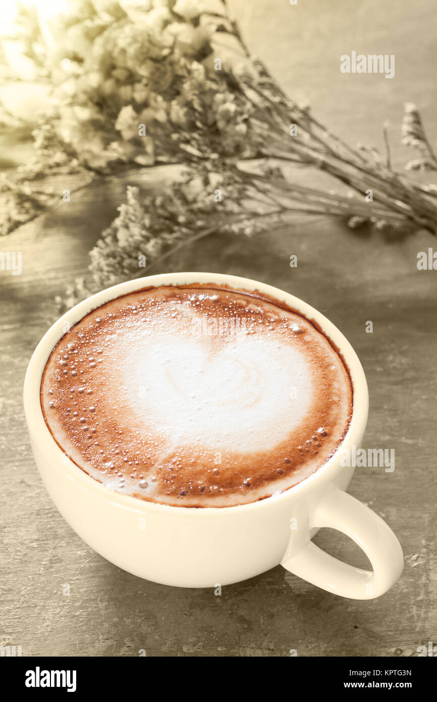 Coffee cup and beautiful flower Stock Photo - Alamy