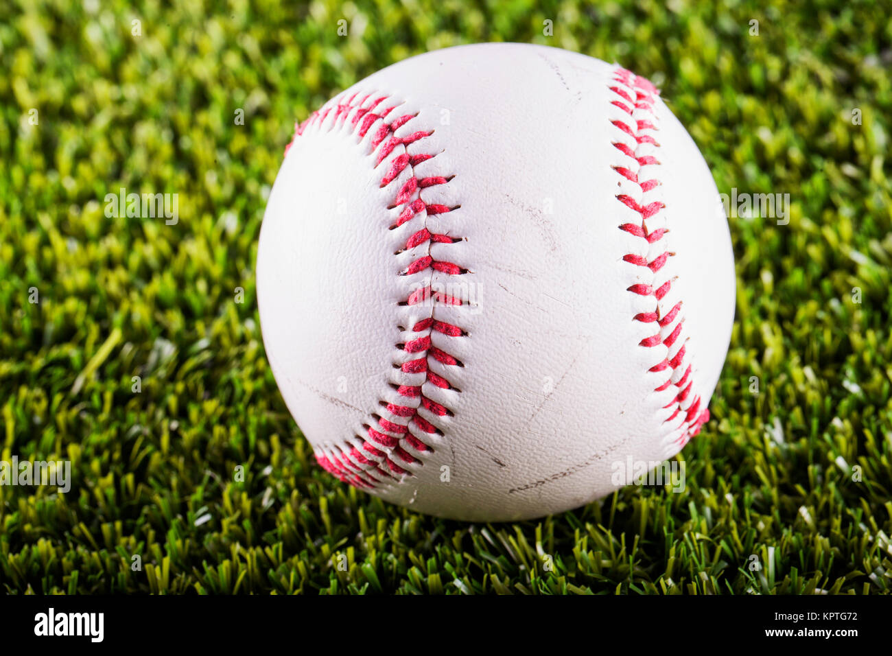Baseball over grass Stock Photo - Alamy