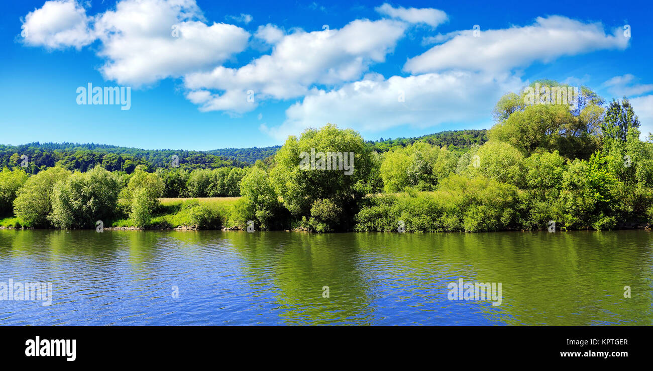Lake under a sky.Picturesque forest and the river Stock Photo - Alamy