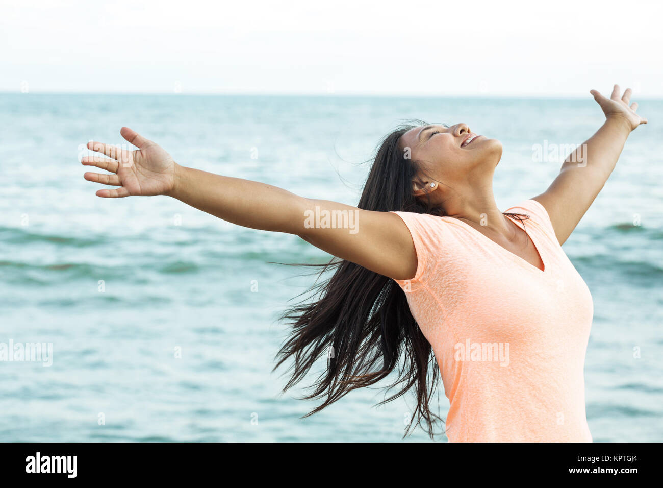 Asian woman with open arms Stock Photo - Alamy