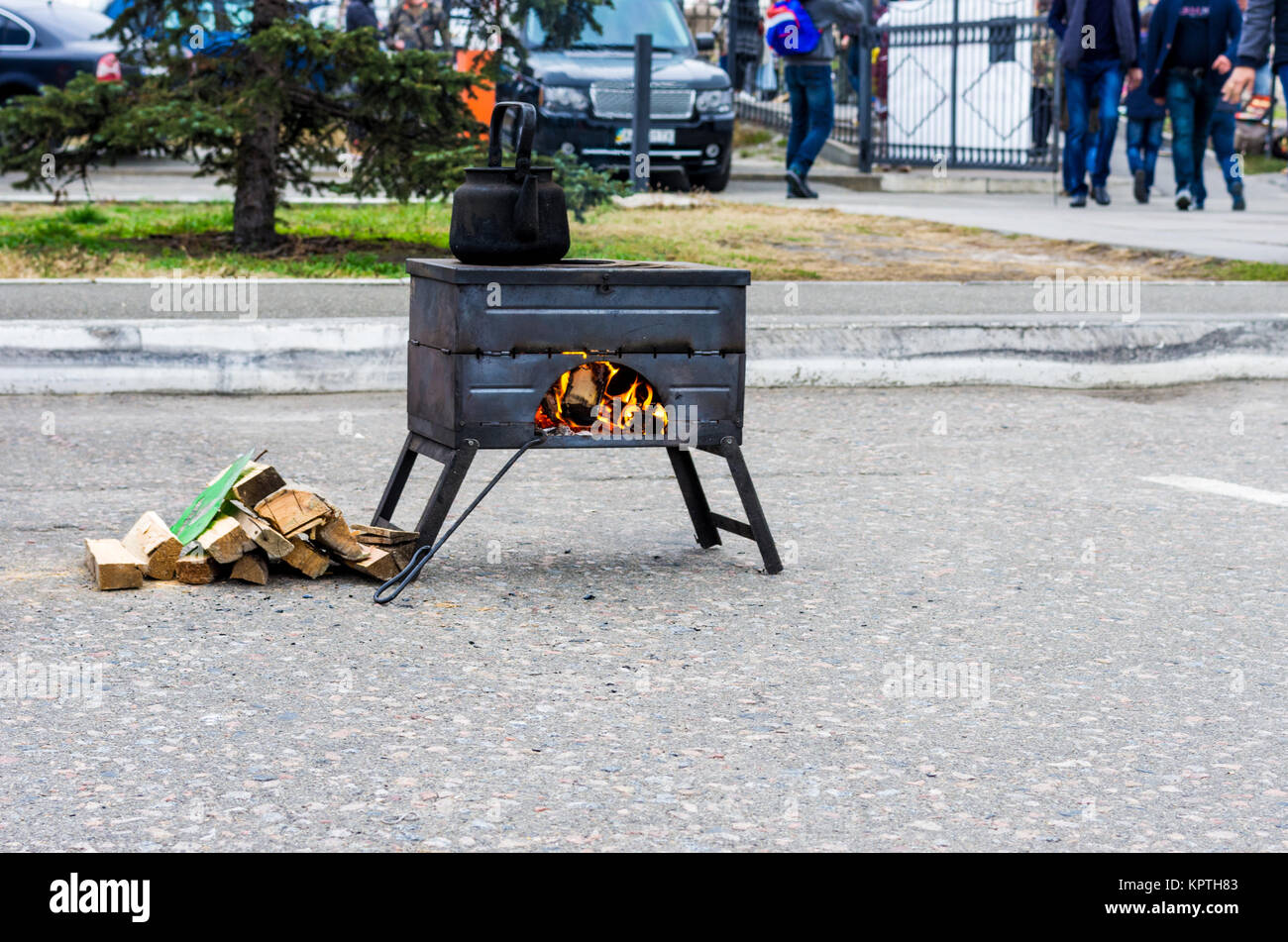 Street brazier with scorching fire. Cooking food and tea Stock Photo ...